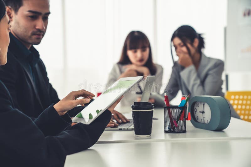 Business People Proficiently Discuss Work Project while Sitting in ...