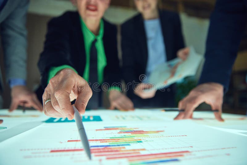 Business People, Project Leaders Pointing at Colorful Business Charts ...