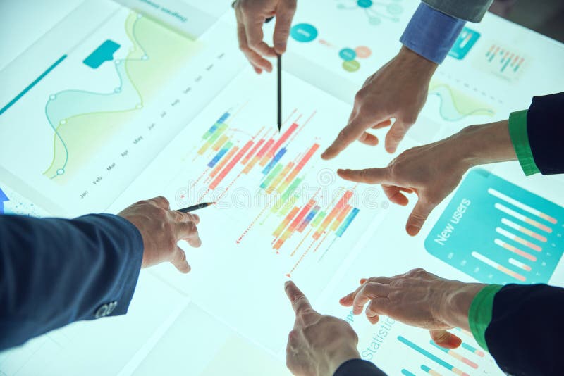 Business People, Project Leaders Pointing at Colorful Business Charts ...