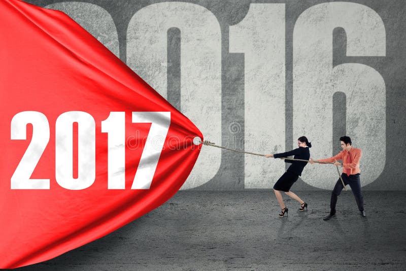 Business People Pulling Flag with 2017 Stock Photo - Image of struggle ...