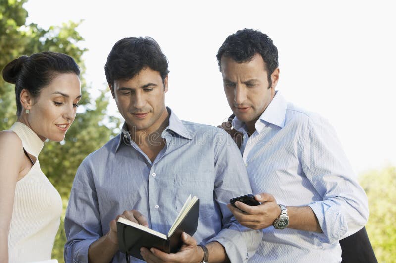 Business People Reading Dairy Stock Photo - Image of communicating ...