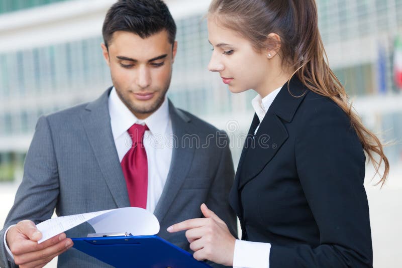 Business People Reading a Document Stock Image - Image of female ...