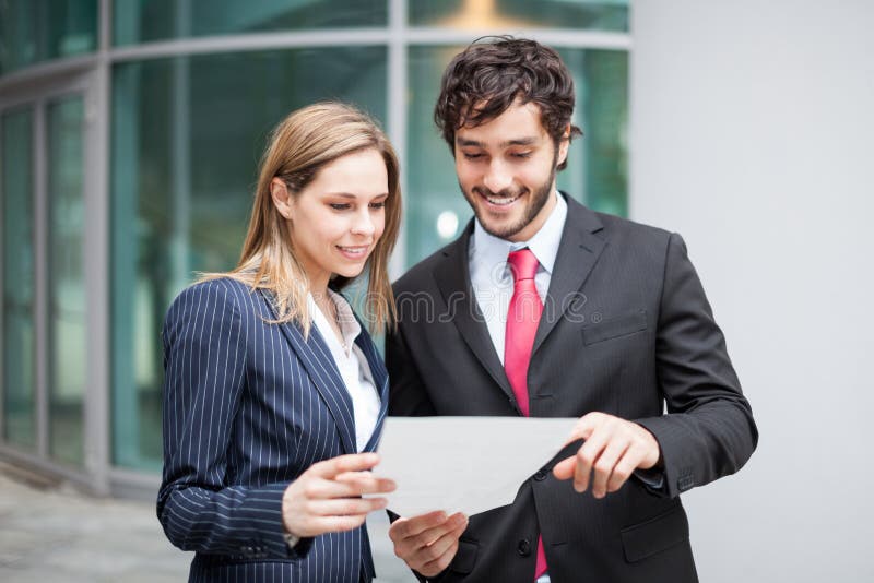 Business People Reading a Document Stock Image - Image of company ...