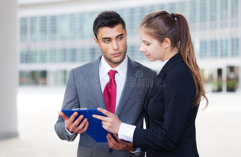 Business People Reading a Document Stock Image - Image of colleagues ...
