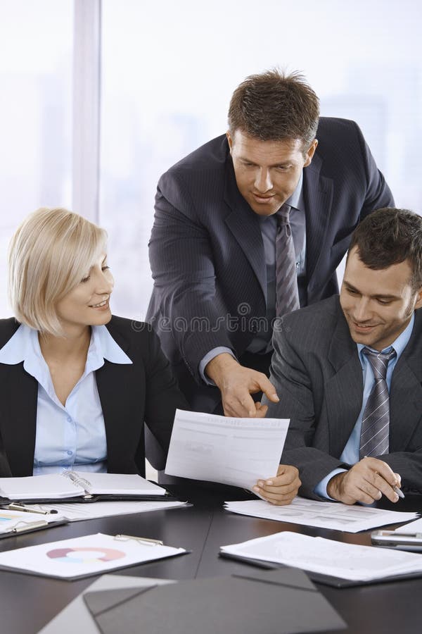 Business People Reviewing Documents Stock Photo - Image of boardroom ...