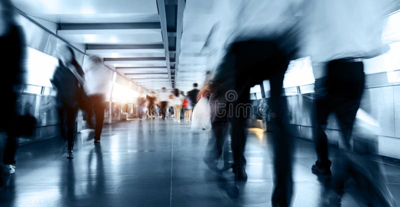 People Rushing in Office Lobby with Motion Blur Stock Photo - Image of ...