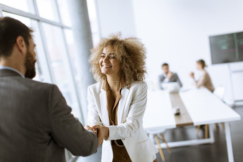 Business People Shake Hands in the Office Stock Photo - Image of curly ...