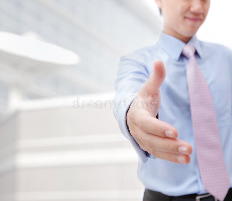 A Business Man with an Open Hand Extended To Handshake Stock Photo ...