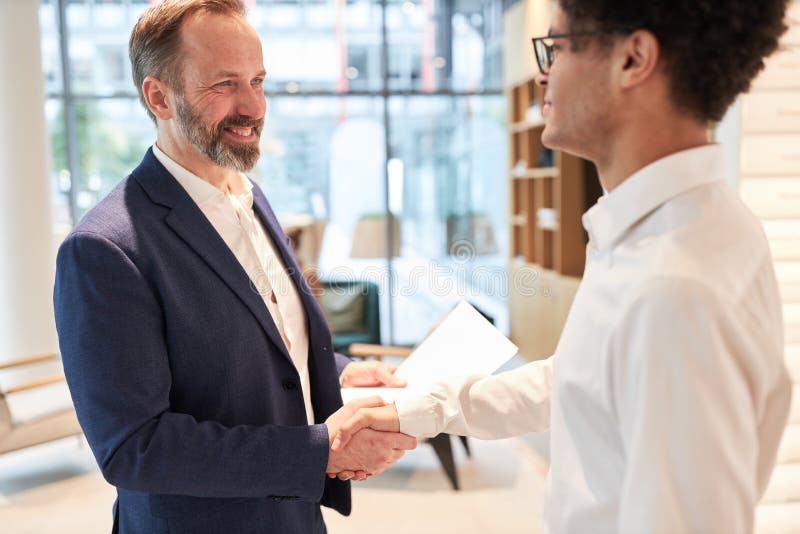 Business People Shaking Hands in Greeting Stock Image - Image of ...