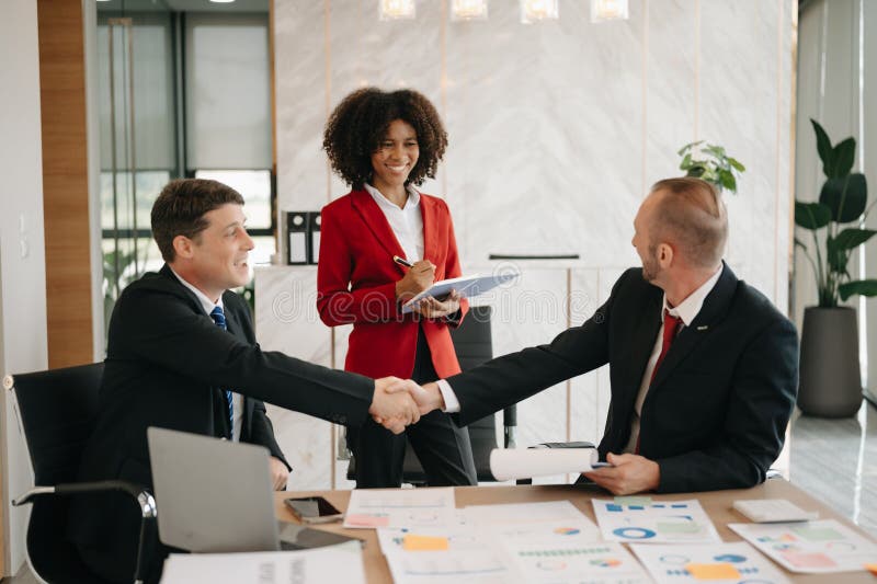 Business People Shaking Hands during a Meeting in Modern Office Stock ...
