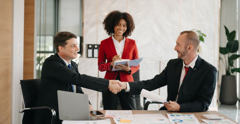 Business People Shaking Hands during a Meeting in Modern Office Stock ...