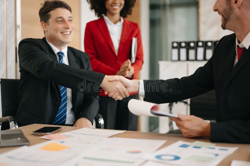 Business People Shaking Hands during a Meeting in Modern Office Stock ...