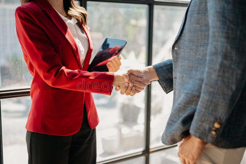 Business People Shaking Hands during a Meeting in Modern Office Stock ... Business People Shaking Hands during a Meeting in Modern Office Stock ...
