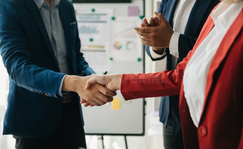 Business People Shaking Hands during a Meeting in Office Stock Photo ...