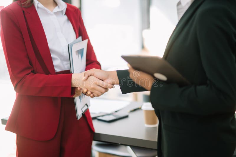 Business People Shaking Hands during a Meeting in Office Stock Photo ...