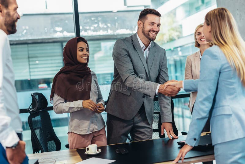 Business People Shaking Hands in the Office. Stock Image - Image of ...