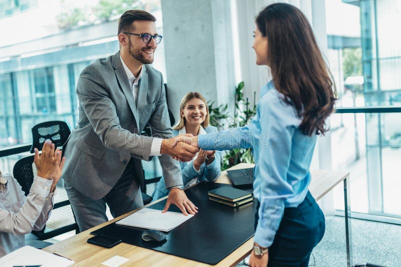 Business People Shaking Hands in the Office. Stock Image - Image of ...