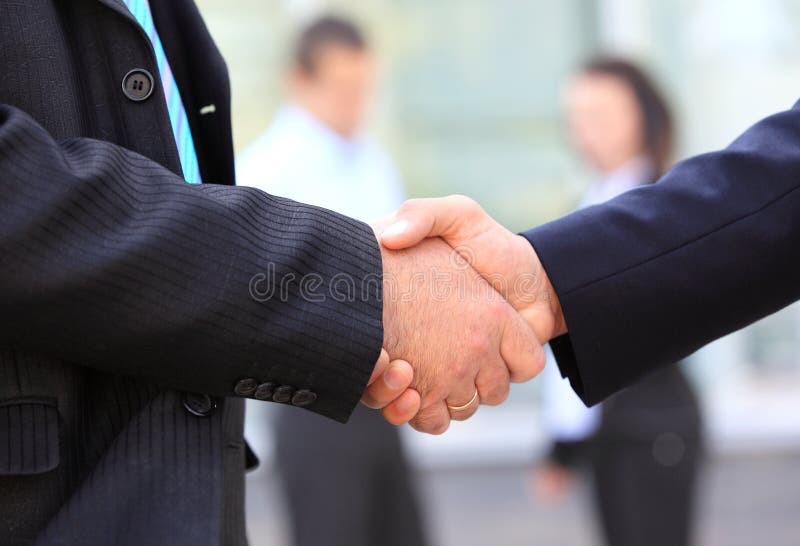 Business People Shaking Hands Over a Deal Stock Photo - Image of ...
