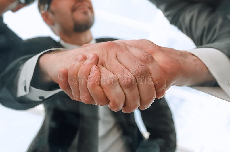 Business People Shaking Hands Over the Office Desk Stock Image - Image ...