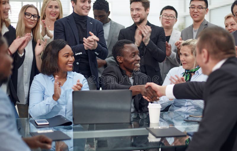 Business People Shaking Hands Over an Office Desk. Stock Photo - Image ...