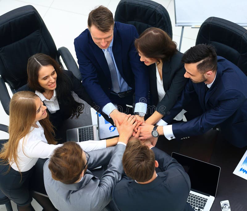 Business People Showing Unity with Their Hands Together Stock Photo ...