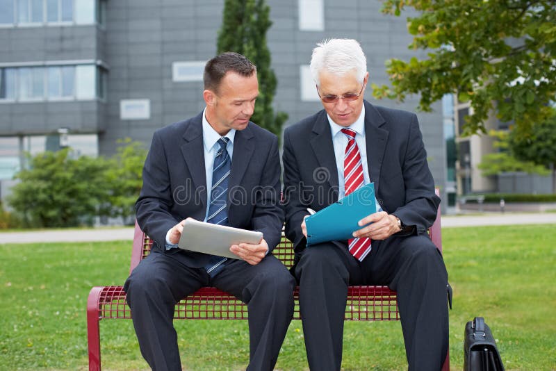 Business People Signing Contract Stock Photo - Image of caucasian, park ...