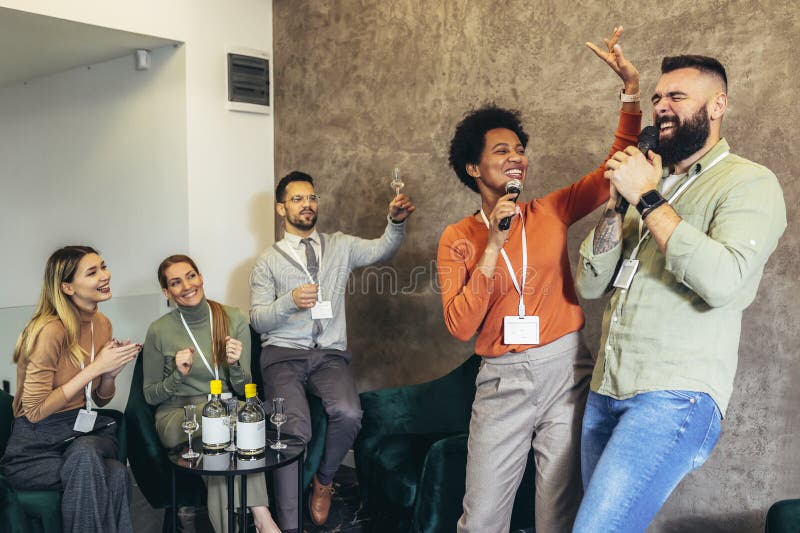 Business People Singing Karaoke in Modern Office Stock Image - Image of ...
