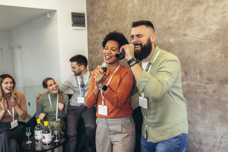 Business People Singing Karaoke in Modern Office Stock Image - Image of ...