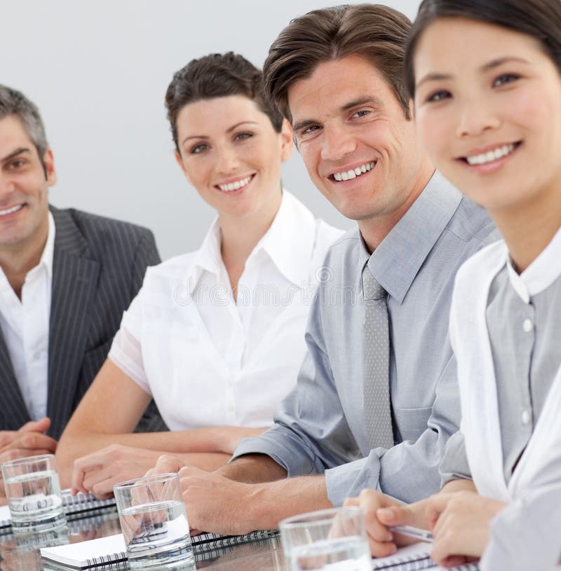 Business People Sitting Around a Conference Table Stock Photo - Image ...