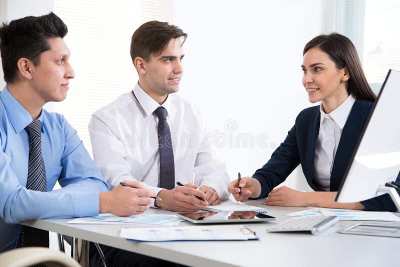 Business People are Sitting Around the Table at a Meeting in the Office ...