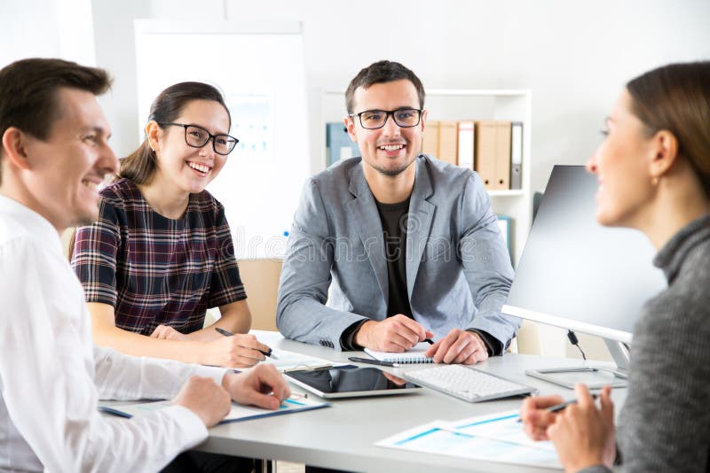 Business People are Sitting Around the Table at a Meeting in the Office ...