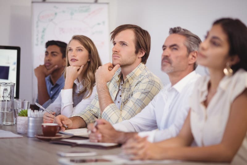 Business People Sitting in Conference Room at Office Stock Photo ...