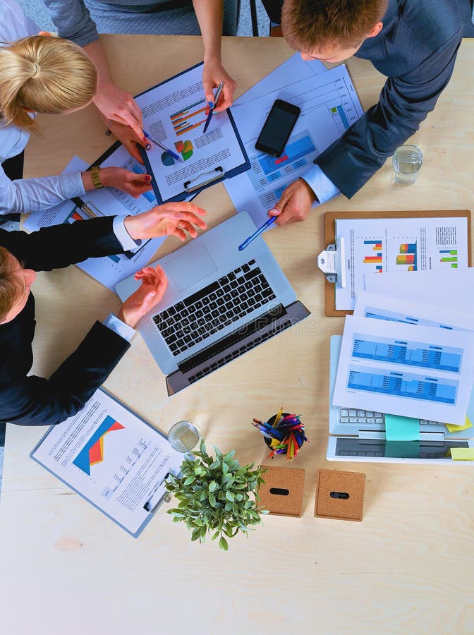 Business People Sitting and Discussing at Business Meeting, in Office ...