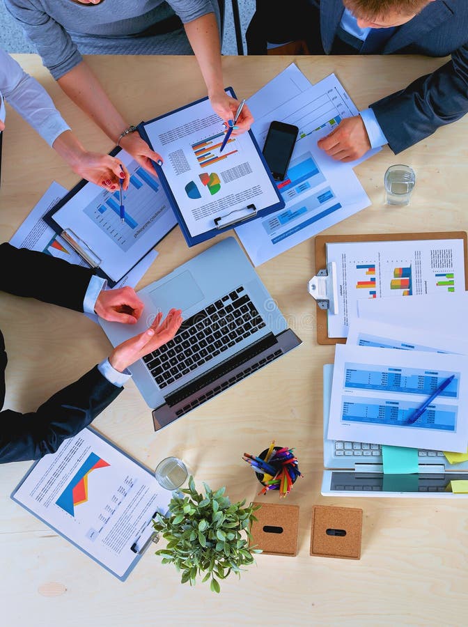 Business People Sitting and Discussing at Business Meeting, in Office ...