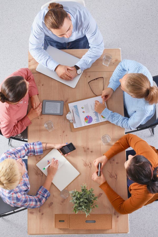 Business People Sitting and Discussing at Meeting, in Office Stock ... Business People Sitting and Discussing at Meeting, in Office Stock ...