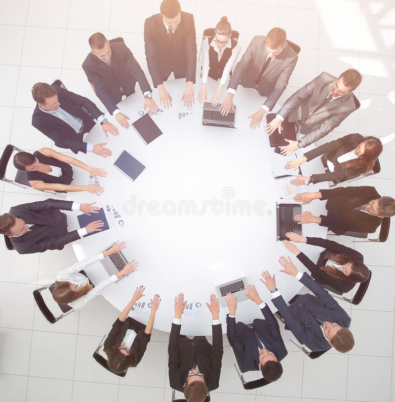 Group of Business People Sitting at the Round Table, and Putting His ...
