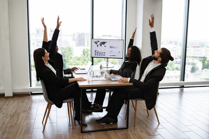 Business Team Celebrating Successful Task Completion in Office Stock ...