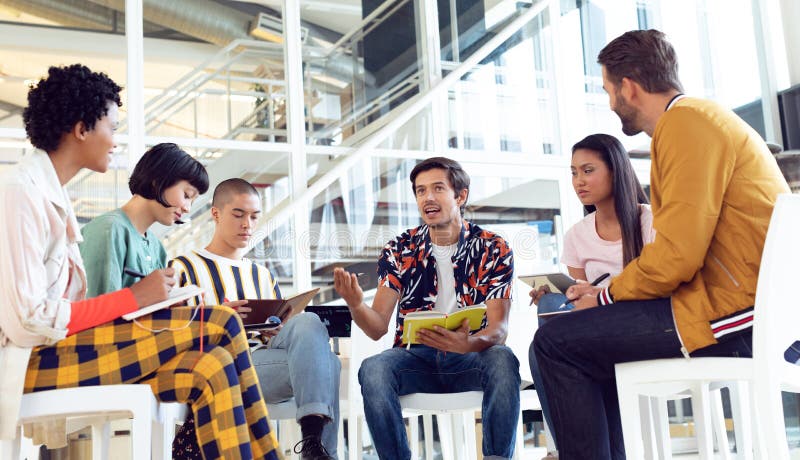 Business People Sitting Together and Having Group Discussion in Office ...