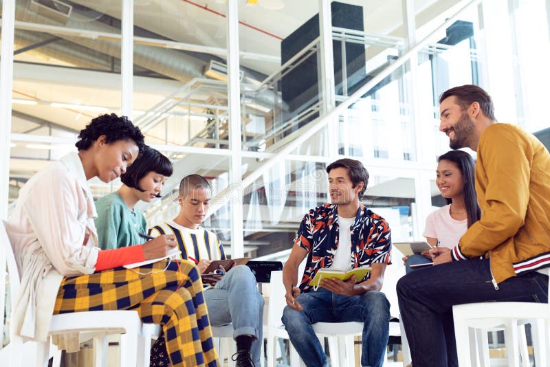 Business People Sitting Together and Having Group Discussion in Office ...