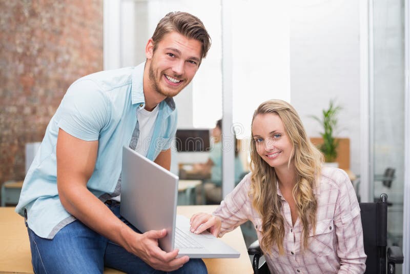 Business People Smiling and Working Together with a Laptop Stock Photo ...