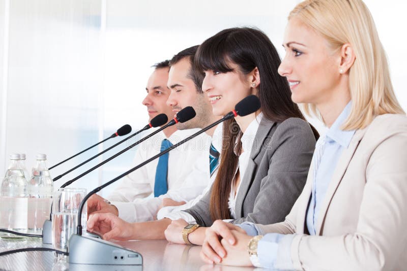 Business People Speaking in Microphone Stock Image - Image of ...