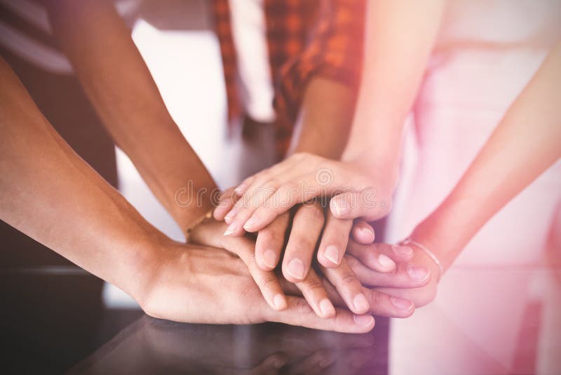 Business People Stacking Hands on Table in Office Stock Image - Image ...