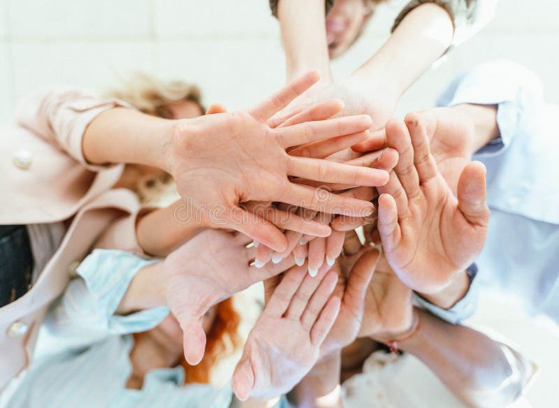 Business People Stacking Their Hands To Show Unity and Support Stock ...