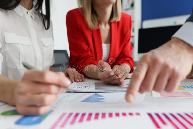 Business People in Suits Discussing Data on Graphs Closeup Stock Image ...