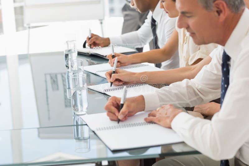 Business People Taking Notes at a Meeting Stock Image - Image of ...