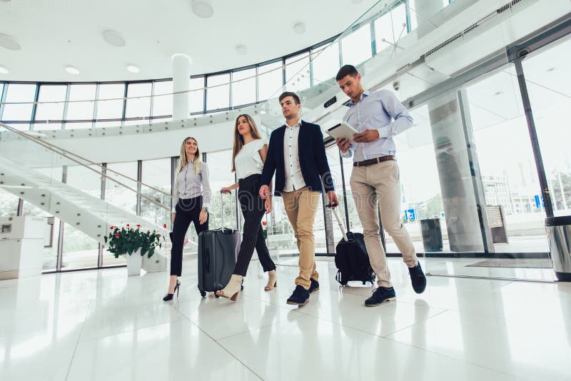 Business People Talk and Walk Together with Digital Tablet Tablet and ...