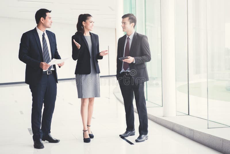 Business People Talking and Discussing Work in Building Hallway Stock ...