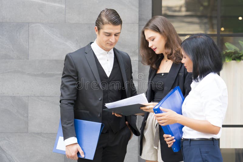 Business People Talking on Front of the Building. Confident Business ...