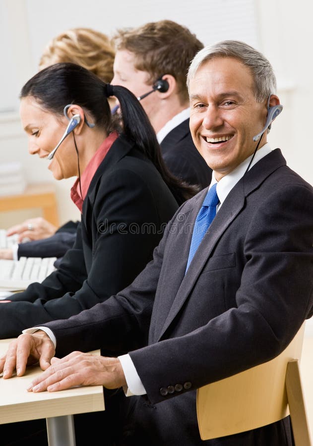 Computers and Headsets from a Call Center Stock Image - Image of office ...