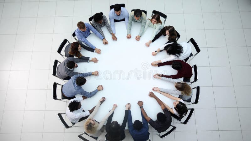 Business People Talking in Office Sitting at a Round Table Stock Photo ...
